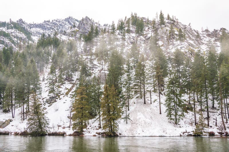 The Snow Mountain with Reflection on a Lake in Winter Stock Image ...