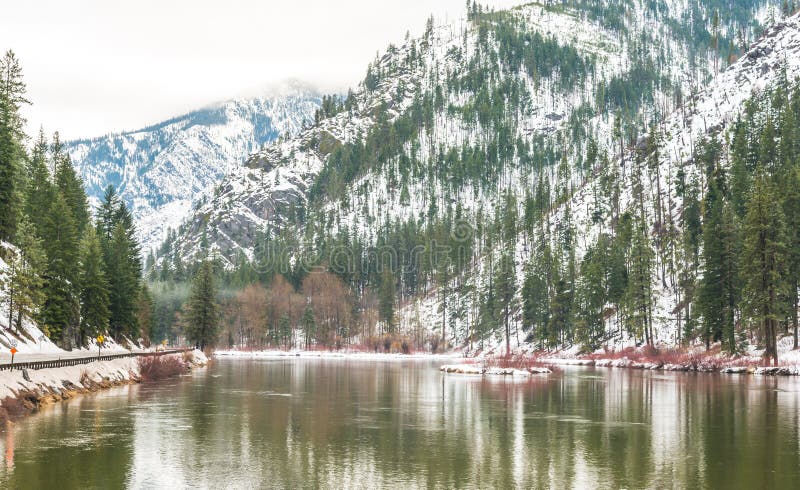 The Snow Mountain with Reflection on a Lake in Winter Stock Image ...