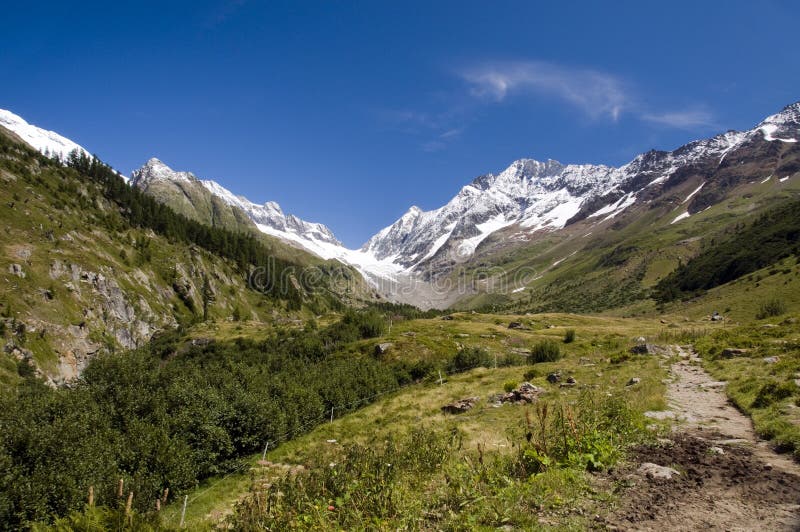 Snow on the Mountains in Summer in Switzerland Stock Photo - Image of ...