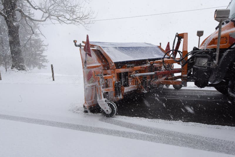 Snow plow on country road stock photo. Image of clearing - 214627472