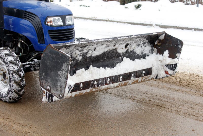 A Snow Plow is on a Road, Clearing the Snow Stock Photo - Image of ...
