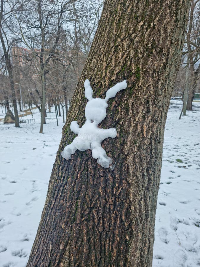 Snow Rabbit on a Tree Trunk Stock Image - Image of forest, playing ...