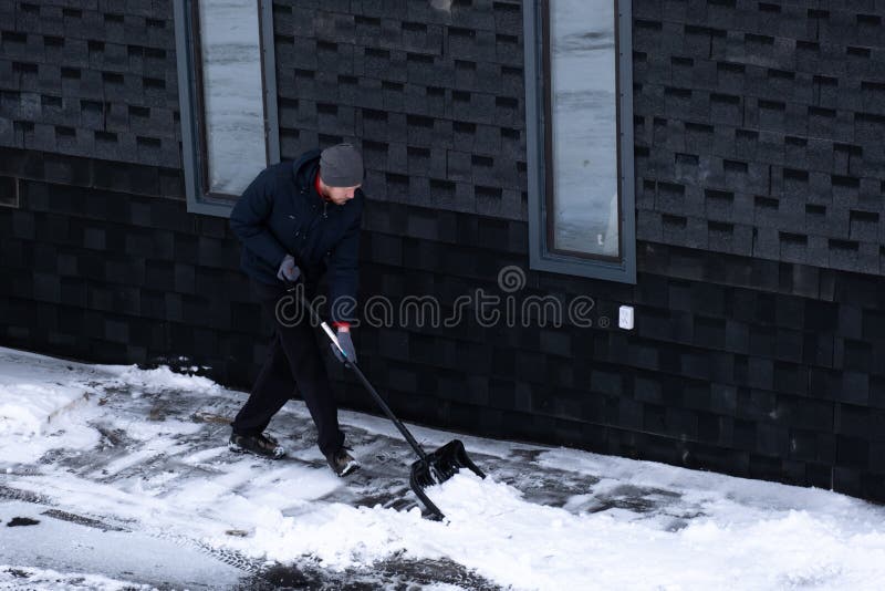 Snow Removal in Front of the House Stock Image - Image of adult, snow ...