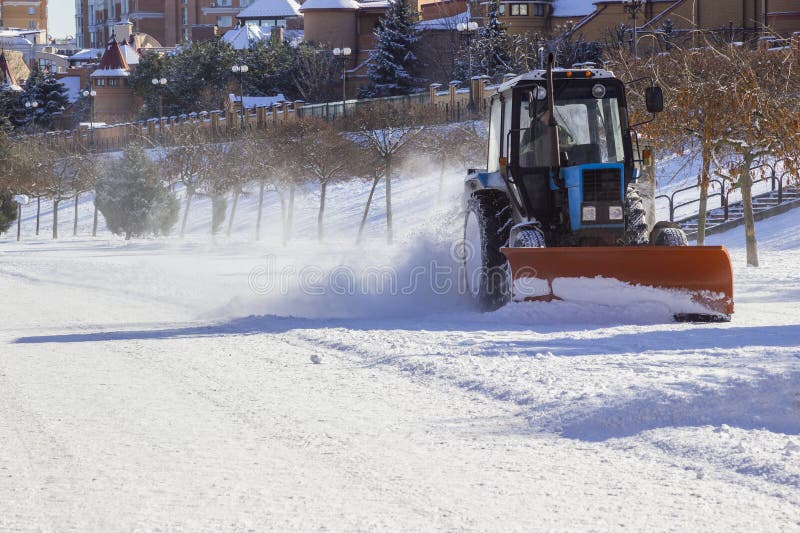 Snow Removal Machine Clears the Way in a Cottage Town after Heavy a ...