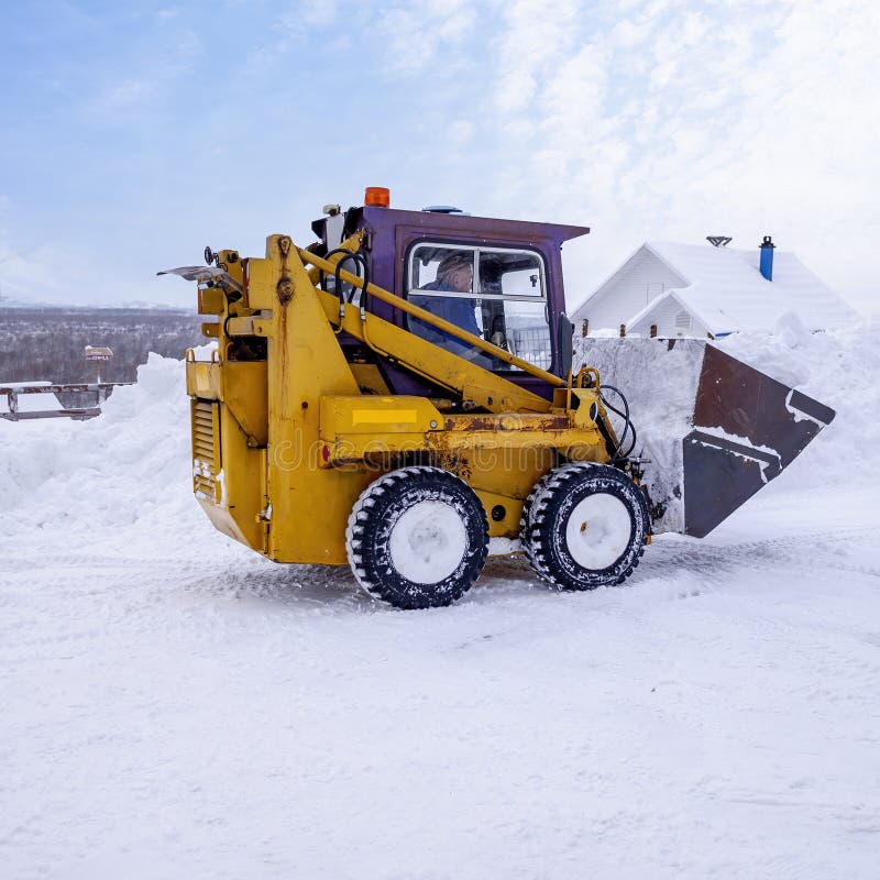 Snow Removal by a Mini Tractor in a Locality Stock Image - Image of ...