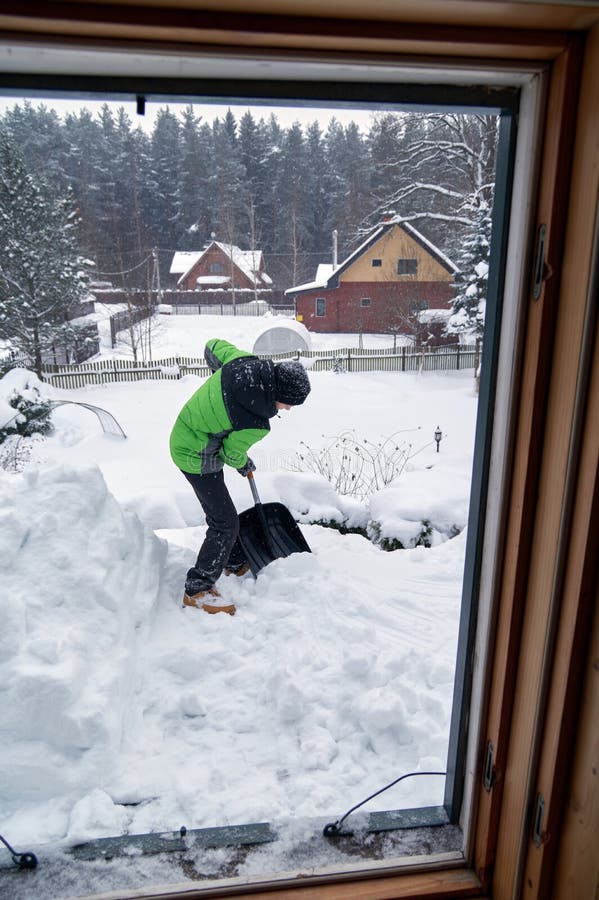 Snow Removal on the Roof. View from the Window of the House. Stock ...