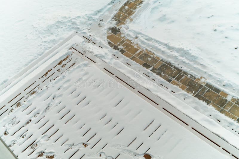 Snow Removal from a Tiled Footpath, Overhead View Stock Photo - Image ...