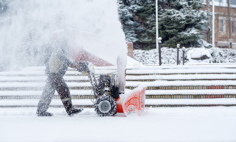 Snow-removal Work with a Snow Blower. Man Removing Snow Stock Image ...