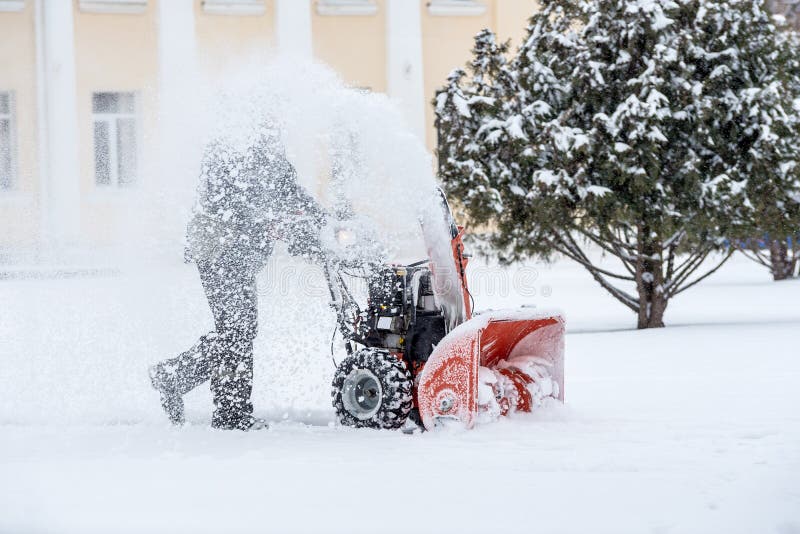 Snow-removal Work with a Snow Blower. Man Removing Snow. Heavy ...