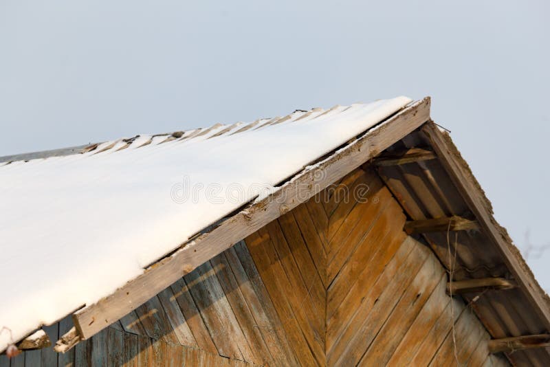 Snow on the Roof of the House at Sunset Stock Photo - Image of village ...