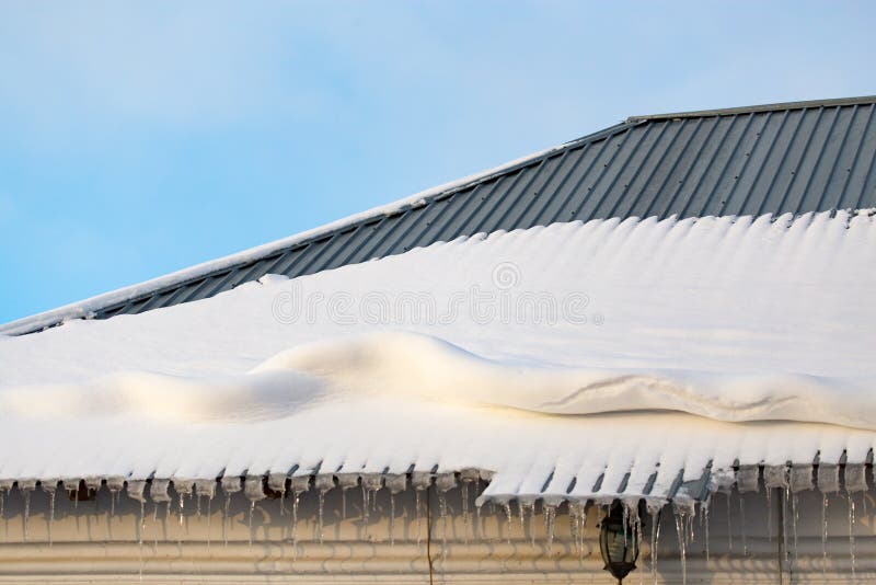 Snow on the Roof of the House at Sunset Stock Photo - Image of snowy ...