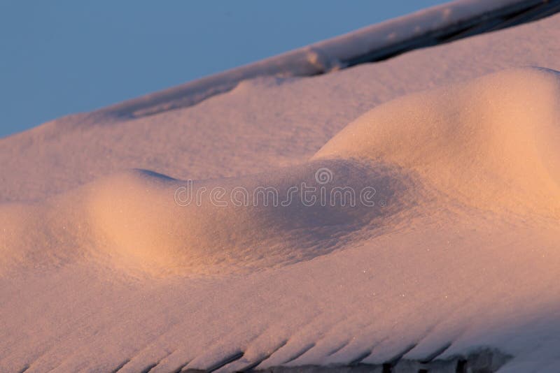 Snow on the Roof of the House at Sunset Stock Photo - Image of sunset ...