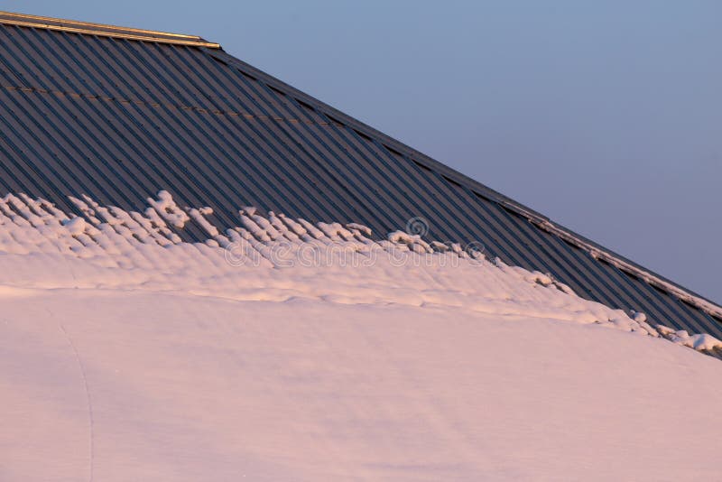 Snow on the Roof of the House at Sunset Stock Image - Image of ...