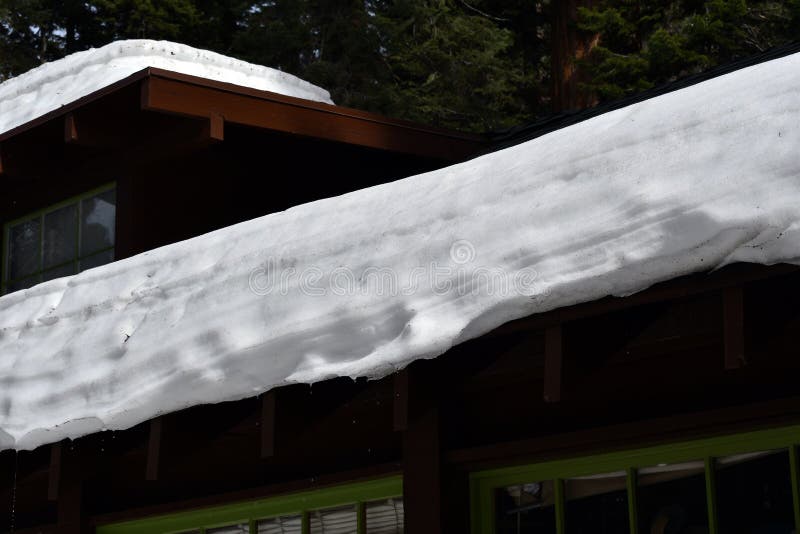 A snow on roof inch deep stock photo. Image of icicle - 170769092