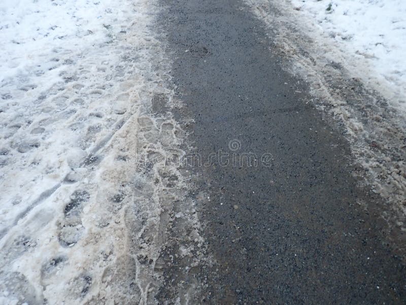 Snow on a Sidewalk in a City Park Stock Image - Image of freeze, cold ...