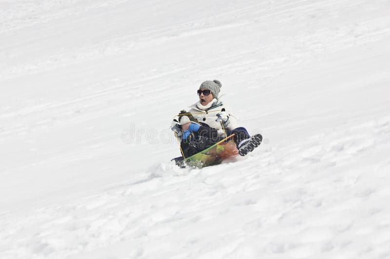 Snow sledding Crash stock image. Image of hillside, sliding - 29699165