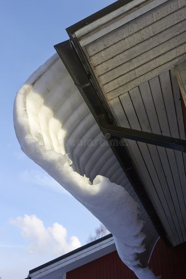 Snow Sliding off the Roof stock image. Image of screenshot - 210932159