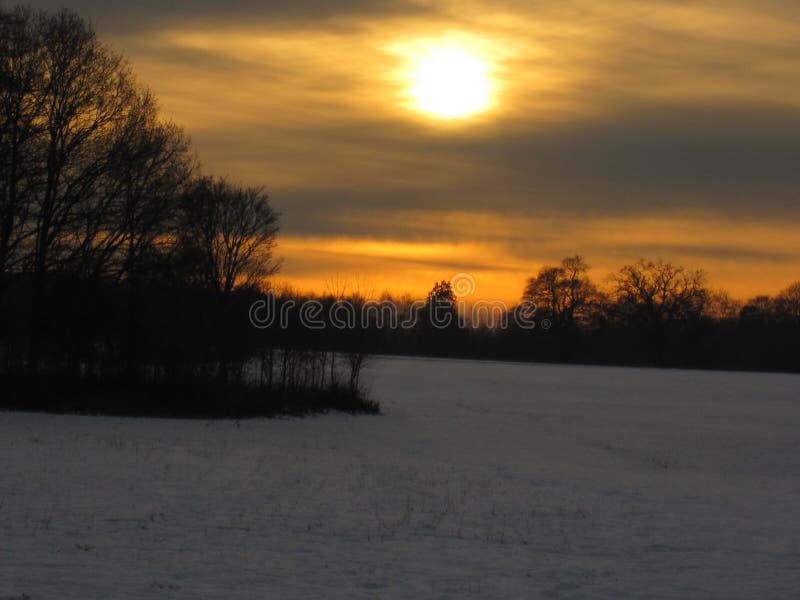 Snowy Sunset stock photo. Image of cold, sunset, snow - 105800144