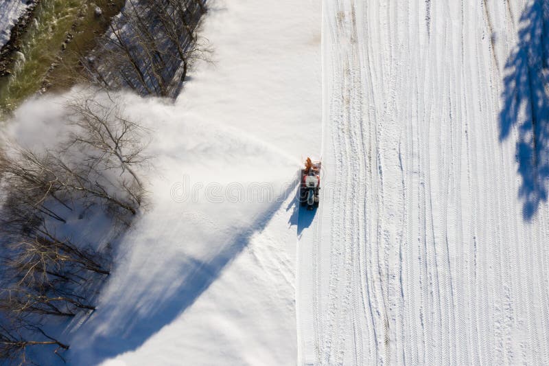 Snow Thrower is Cleaning the Field from the Snow Stock Image - Image of ...