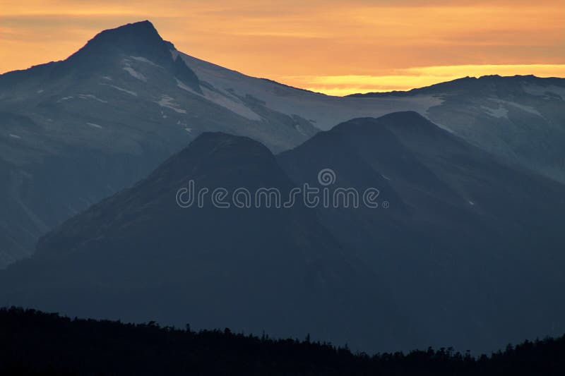 Snow Topped Mountains with Sunset in Alaska Stock Image - Image of ...