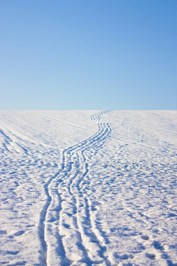 Snow tracks stock image. Image of snow, hill, blue, winter - 12386637