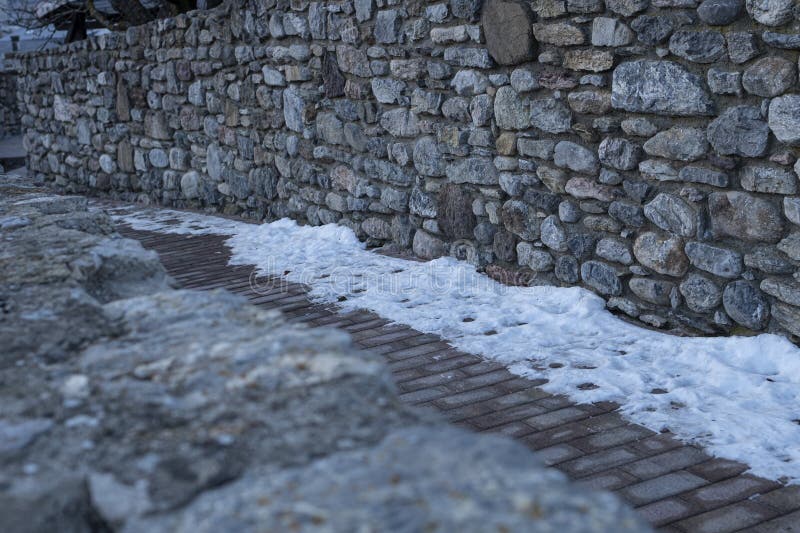 Snow Trail in the Edge of a Cobble Stone Wall Stock Image - Image of ...