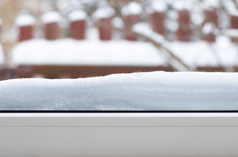 Snow on the window sill stock photo. Image of buildings - 65399246