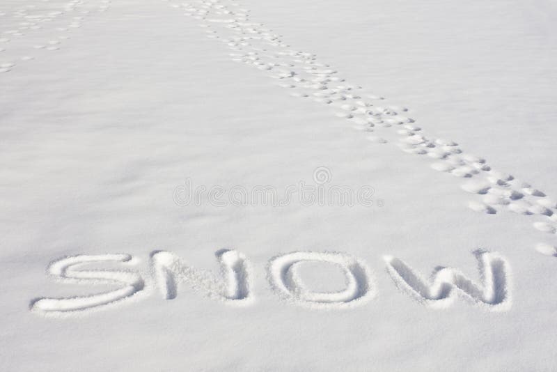 SNOW Written in a Snowy Field beside Footprints Stock Image - Image of ...