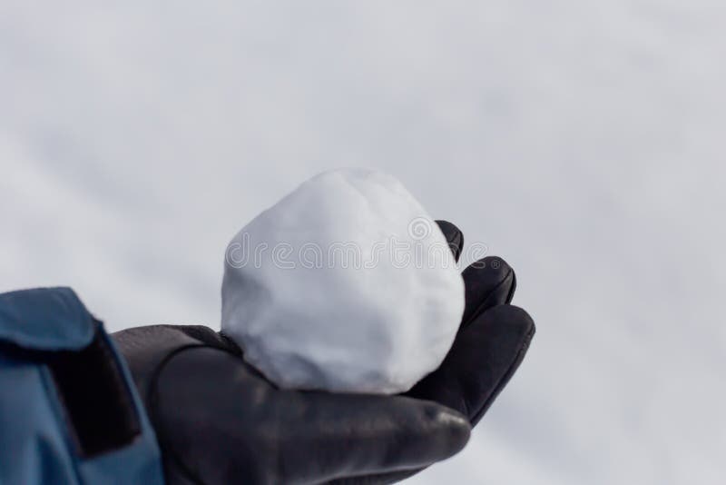 Snowball in a Man& X27;s Hand in a Glove Stock Photo - Image of black ...