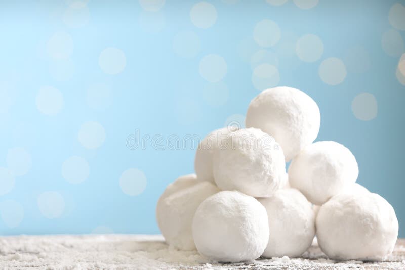 Snowballs on Table Against Blurred Lights, Space for Text Stock Photo ...