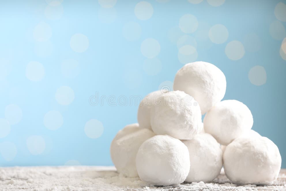 Snowballs on Table Against Blurred Lights, Space for Text Stock Photo ...