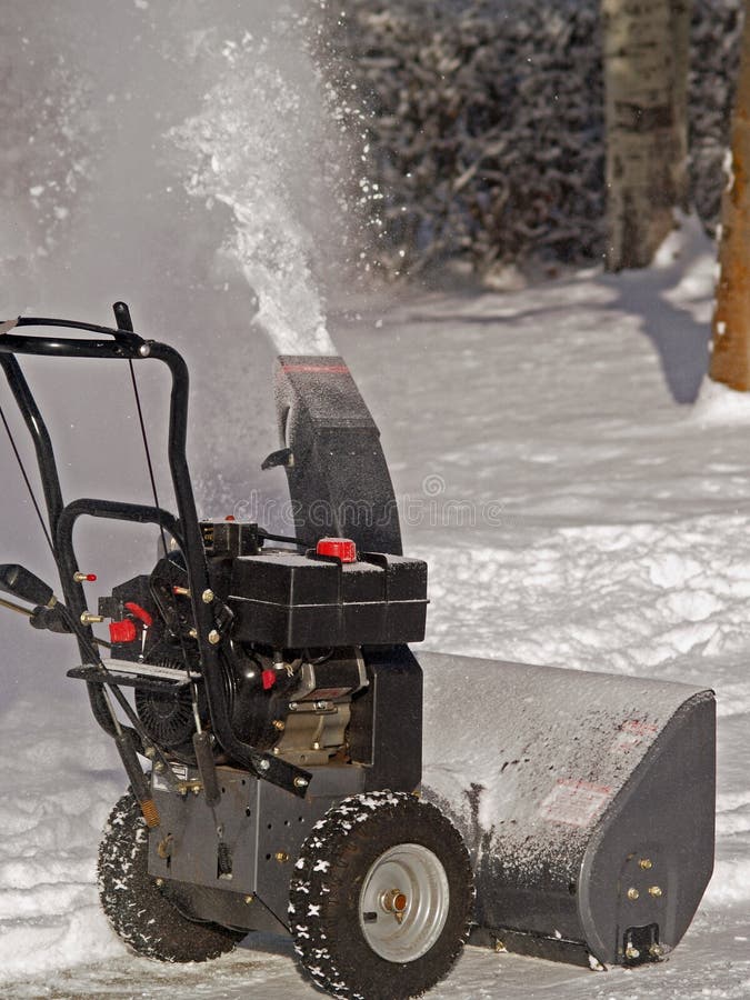 Snowblower in Action stock photo. Image of trunks, hedge - 4062152