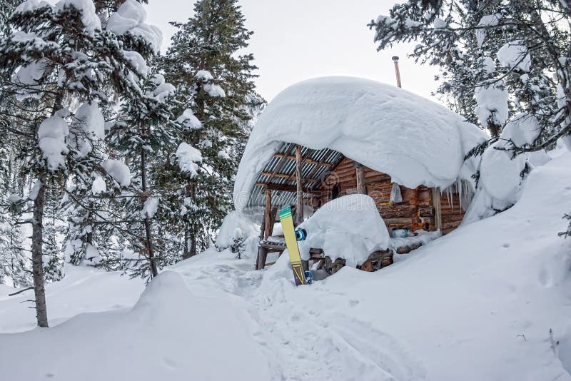 Snowboard at House Chalets in Winter Forest with Snow in Mountains ...