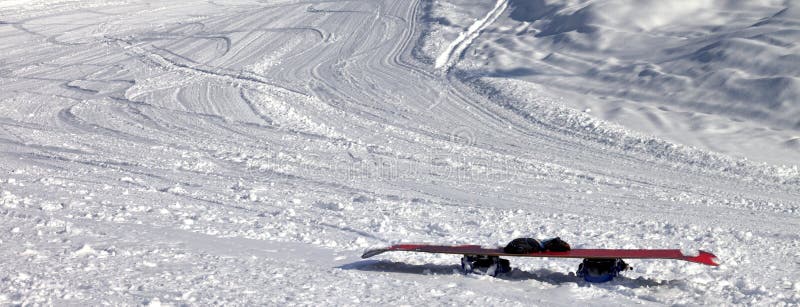 Snowboard in Snow on Snowy Ski Slope at Sun Winter Day Stock Photo ...