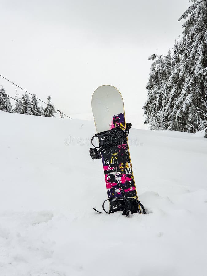 Snowboard Stick Out from the Snow Stock Photo - Image of activities ...