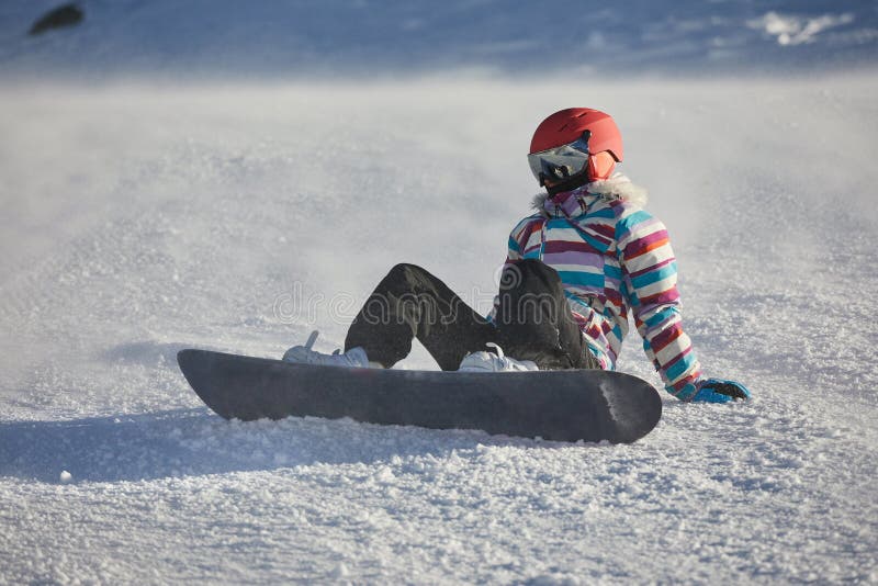 Snowboarder Sitting in the Snlow Stock Photo - Image of board ...
