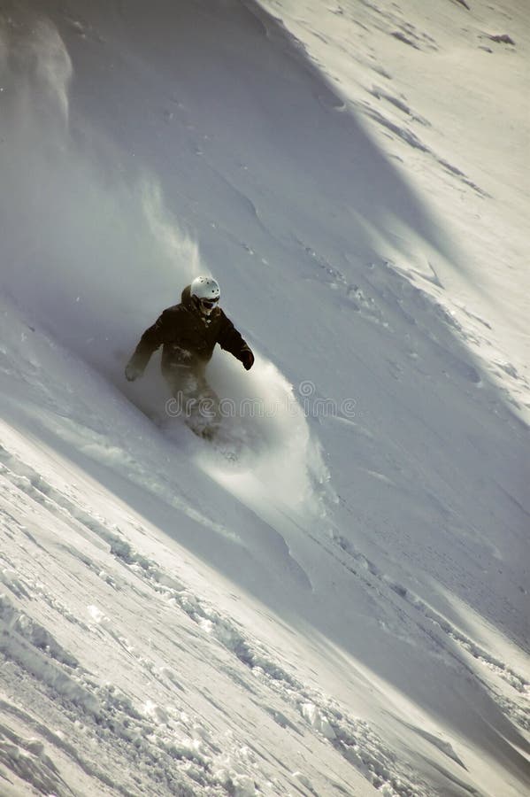Snowboarder in deep powder stock photo. Image of snow - 5012594