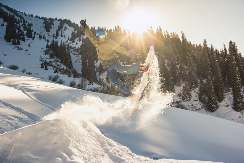 Man Snowboarding Trick Jump on Mountain Snow Jump Stock Photo - Image ...