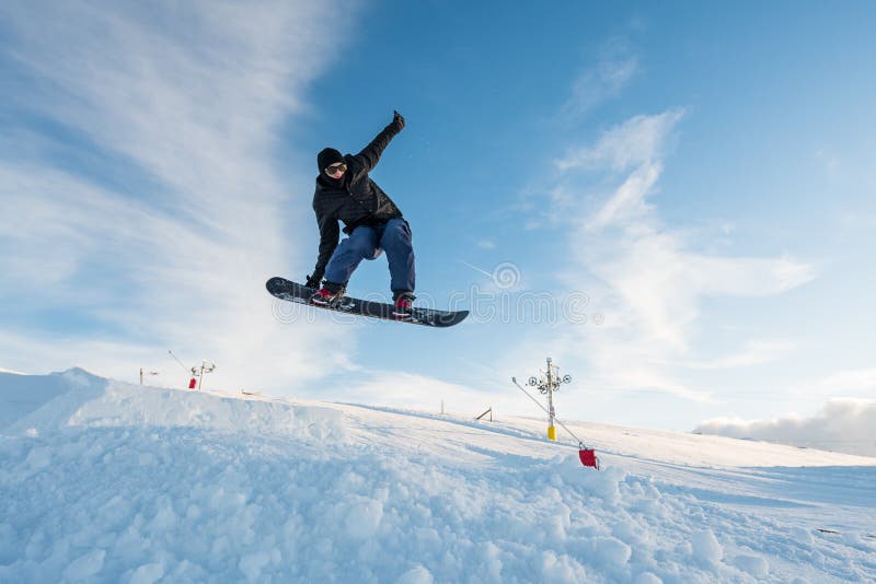 Snowboarder Jumping Against Blue Sky Stock Image - Image of skies ...