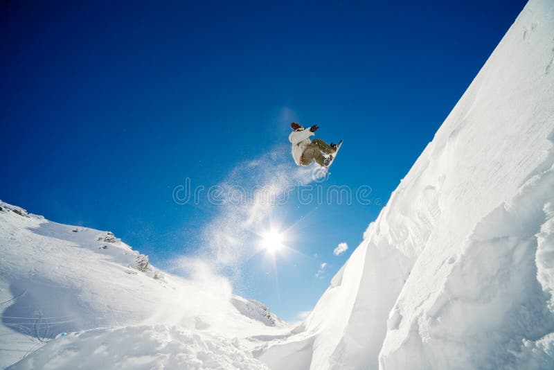 Snowboarder jumping stock image. Image of snowboarding - 6583313