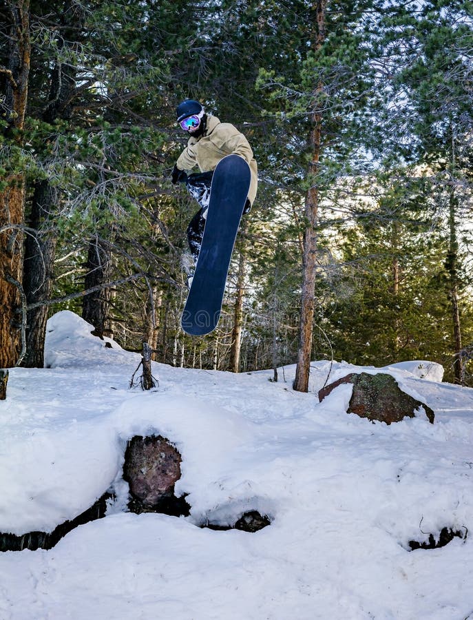 Snowboarder Jumping in the Forest Stock Image - Image of caucasus, male ...