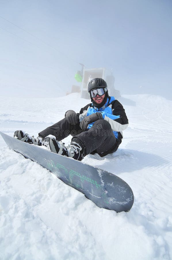 Snowboarder Resting on Mountain Top Stock Photo - Image of frozen ...