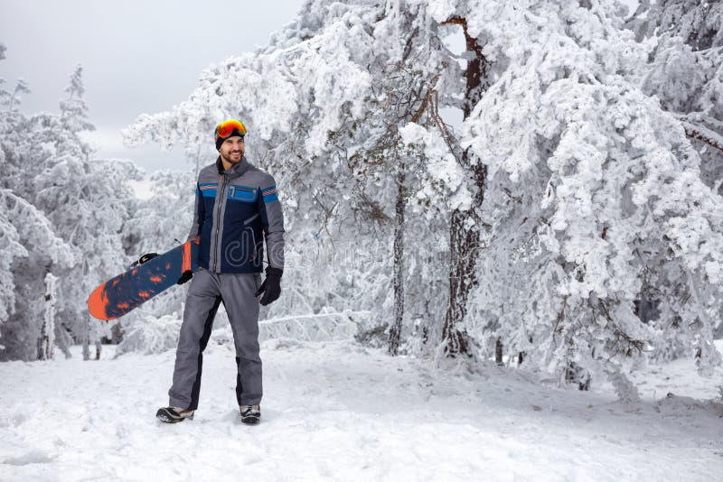 Snowboarder with Snowboard on Winter Holiday in the Mountain Stock ...