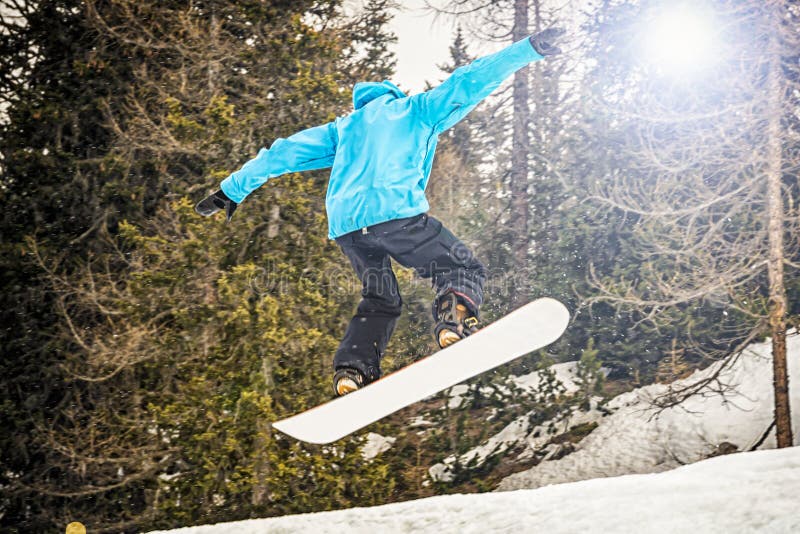 Snowboarder during a Trick on a Slope Stock Image - Image of cold ...