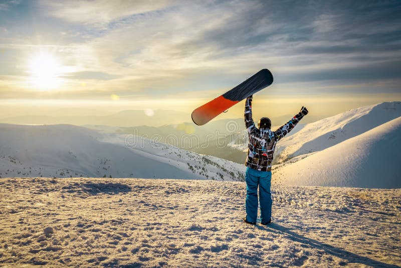 Snowborder Hold His Snowboard in Hand on Sunset Stock Image - Image of ...