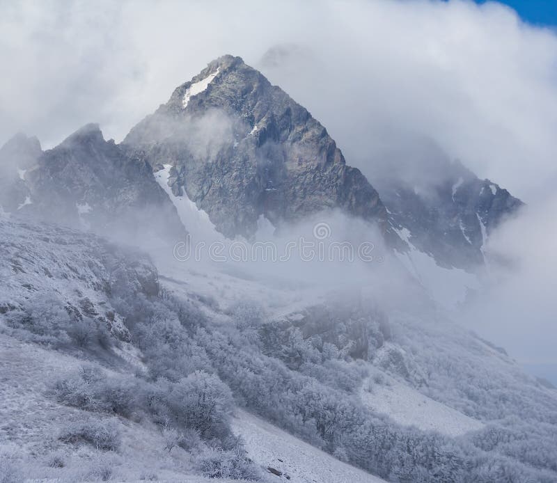 Snowbound Mountain Valley in Dense Mist Stock Image - Image of bright ...