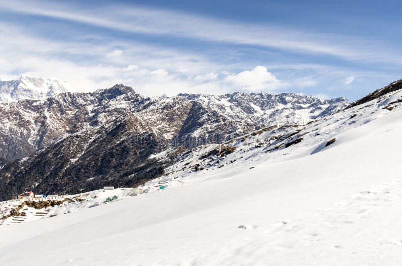Snowcap Mountain Range with Bright Blue Sky at Morning Stock Photo ...