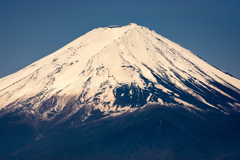 Snowcaped Mt. Fuji stock photo. Image of peak, rocks - 115594148