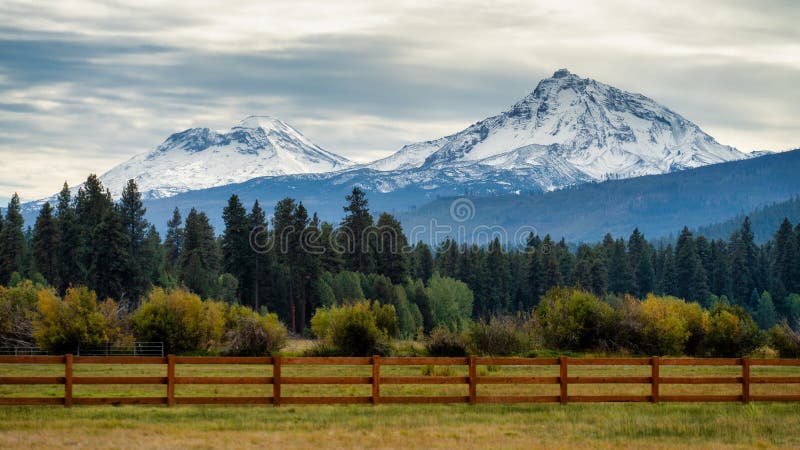 The Snowcapped Sisters Mountains in the the Cascades Mountain Range in ...