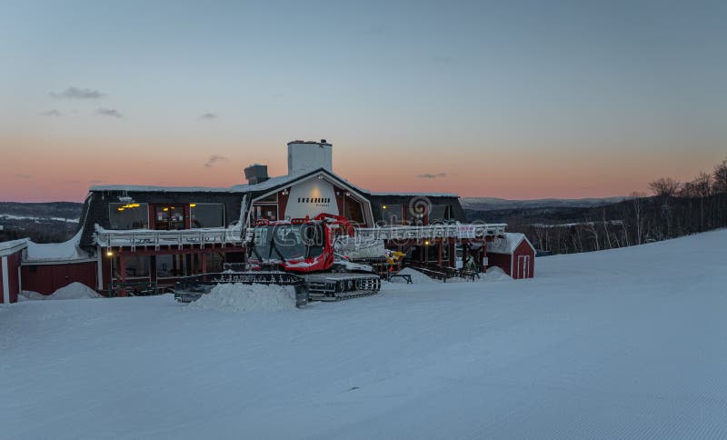 Snowcat in Front of a Ski Lodge at Sunset in Vermont, New England ...